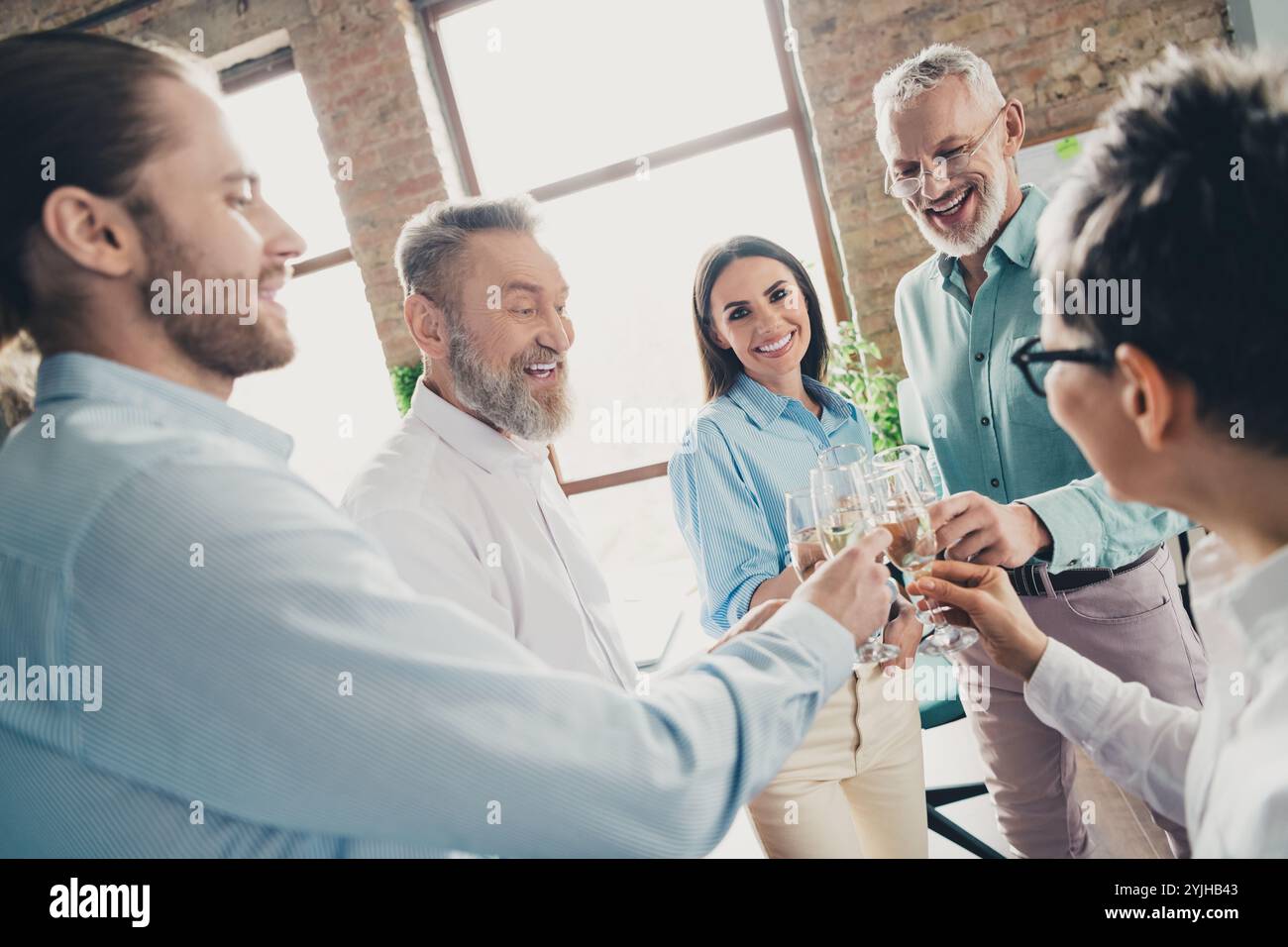 Photo of coworking project teamwork people toast drink champagne work ...