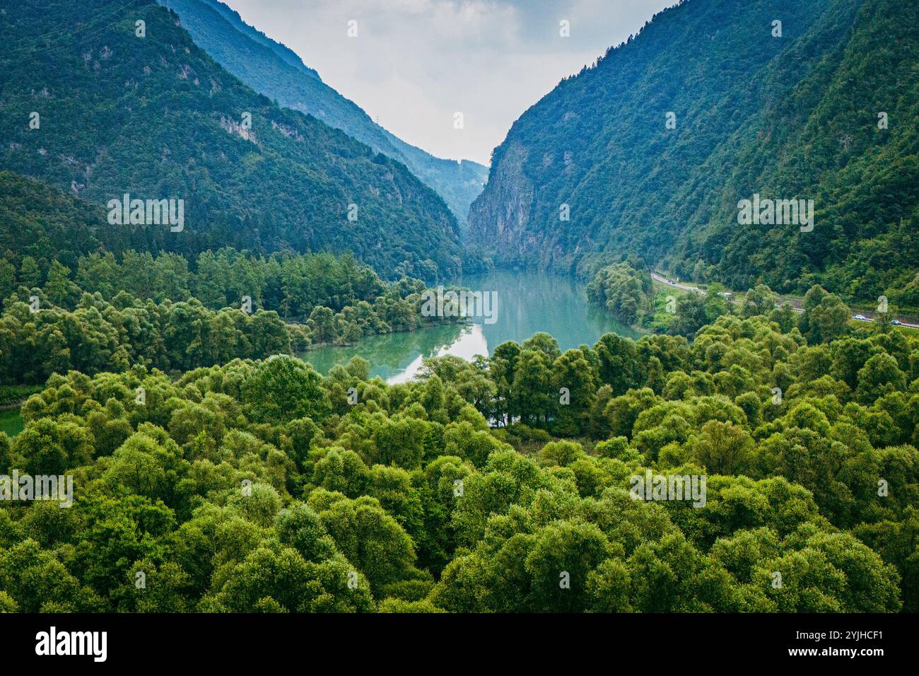 STENICO, ITALY – AUGUST 28, 2024: The serene Lago di Ponte Pià, nestled ...