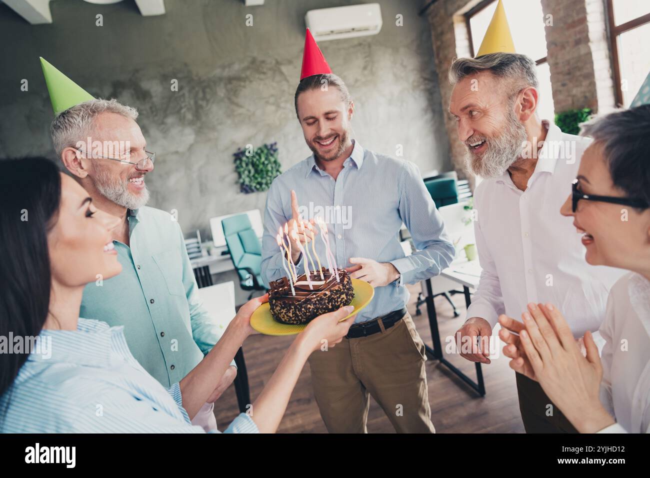 Photo of five successful corporate colleagues clapping gift birthday ...