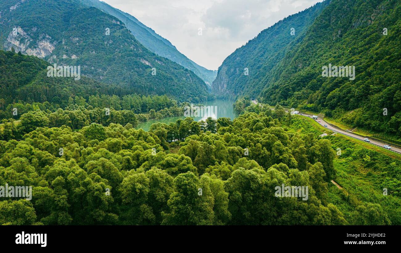 STENICO, ITALY – AUGUST 28, 2024: The serene Lago di Ponte Pià, nestled ...