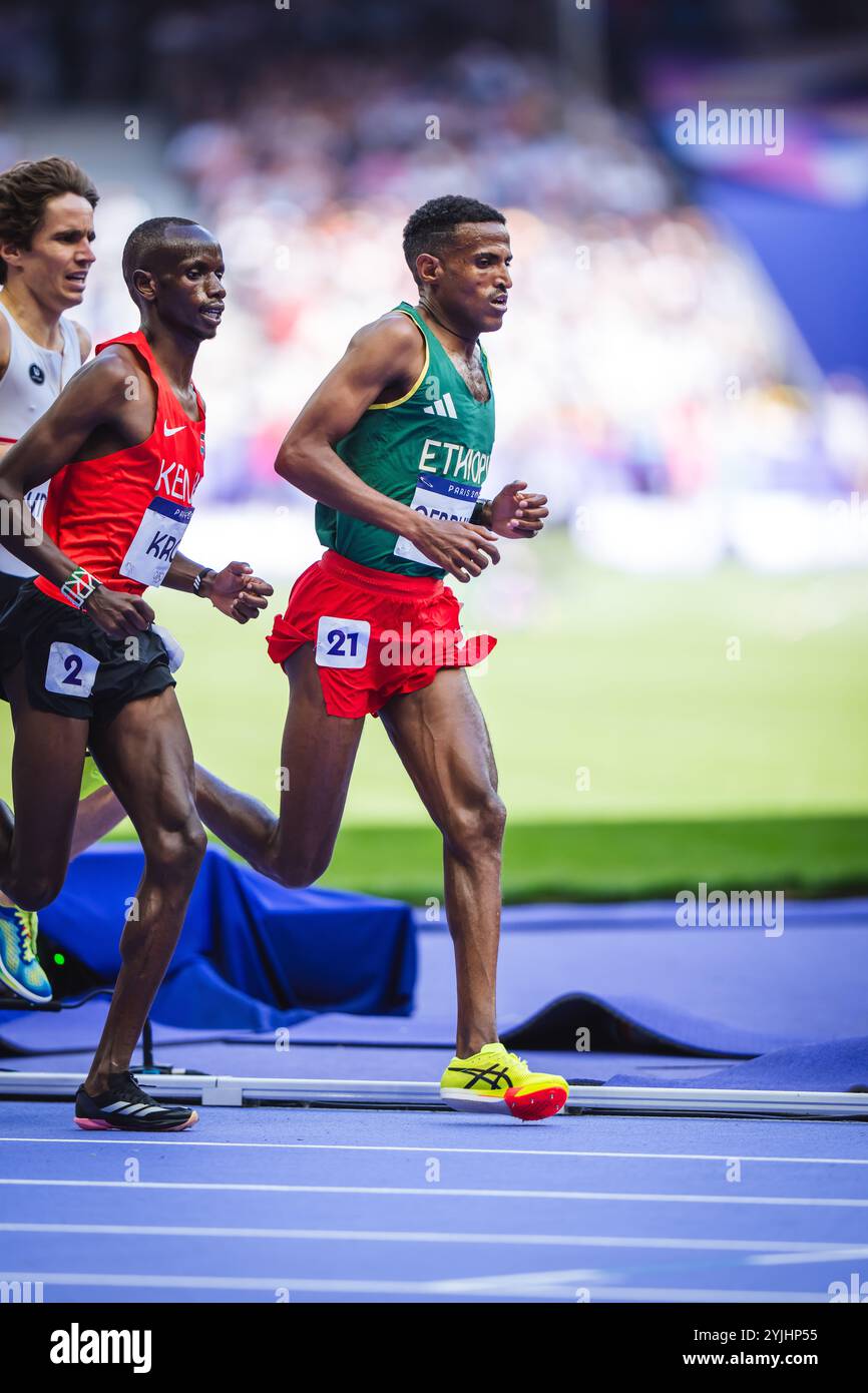 Hagos Gebrhiwet participating in the 5000 meters at the Paris 2024 ...