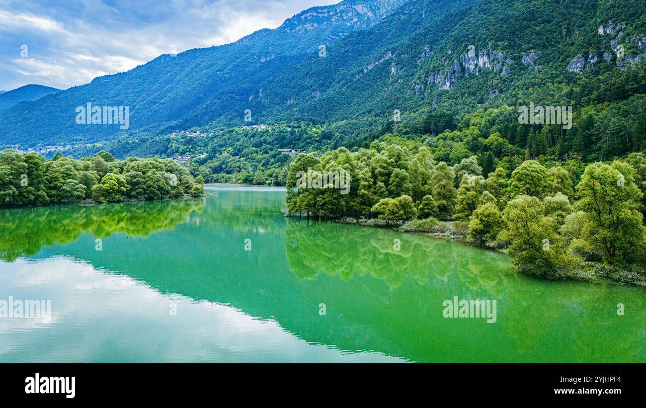 STENICO, ITALY – AUGUST 28, 2024: The serene Lago di Ponte Pià, nestled ...