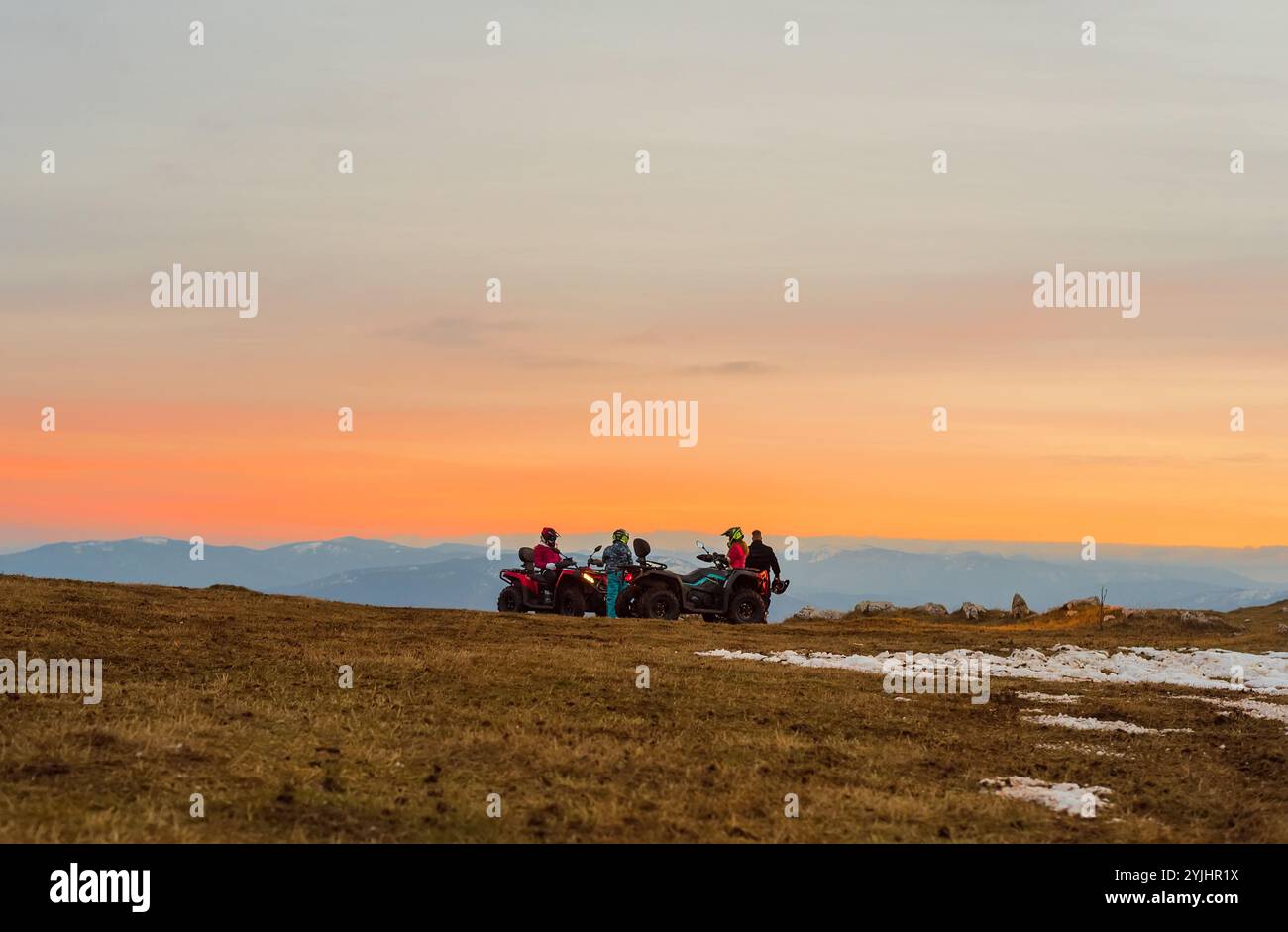 Group of friends riding quad bike atv off road on the mountain at ...