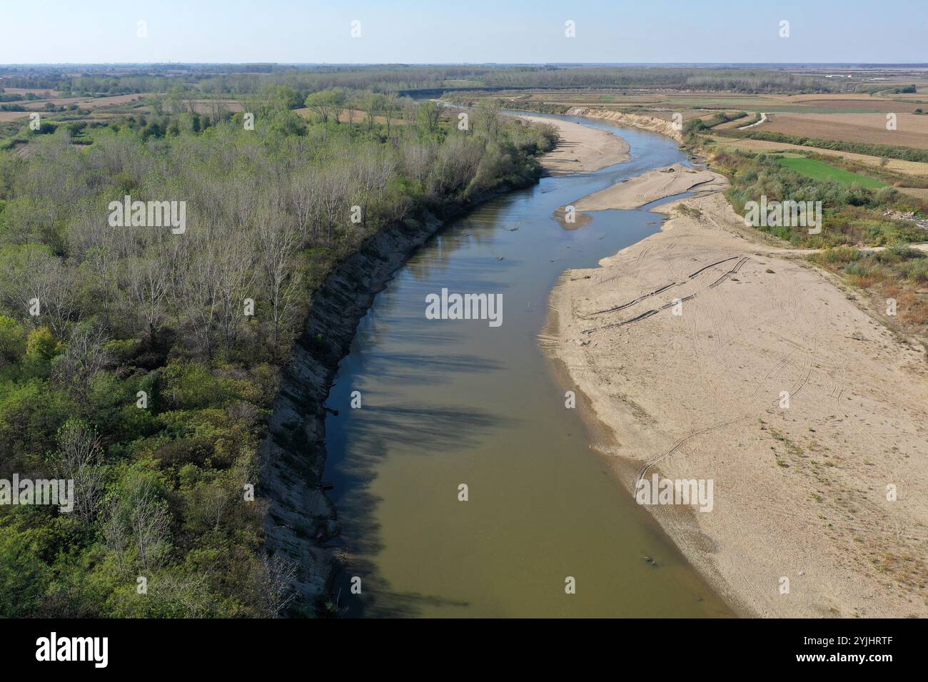 Flying over a river flowing on a plain aerial view by drone Stock Photo ...