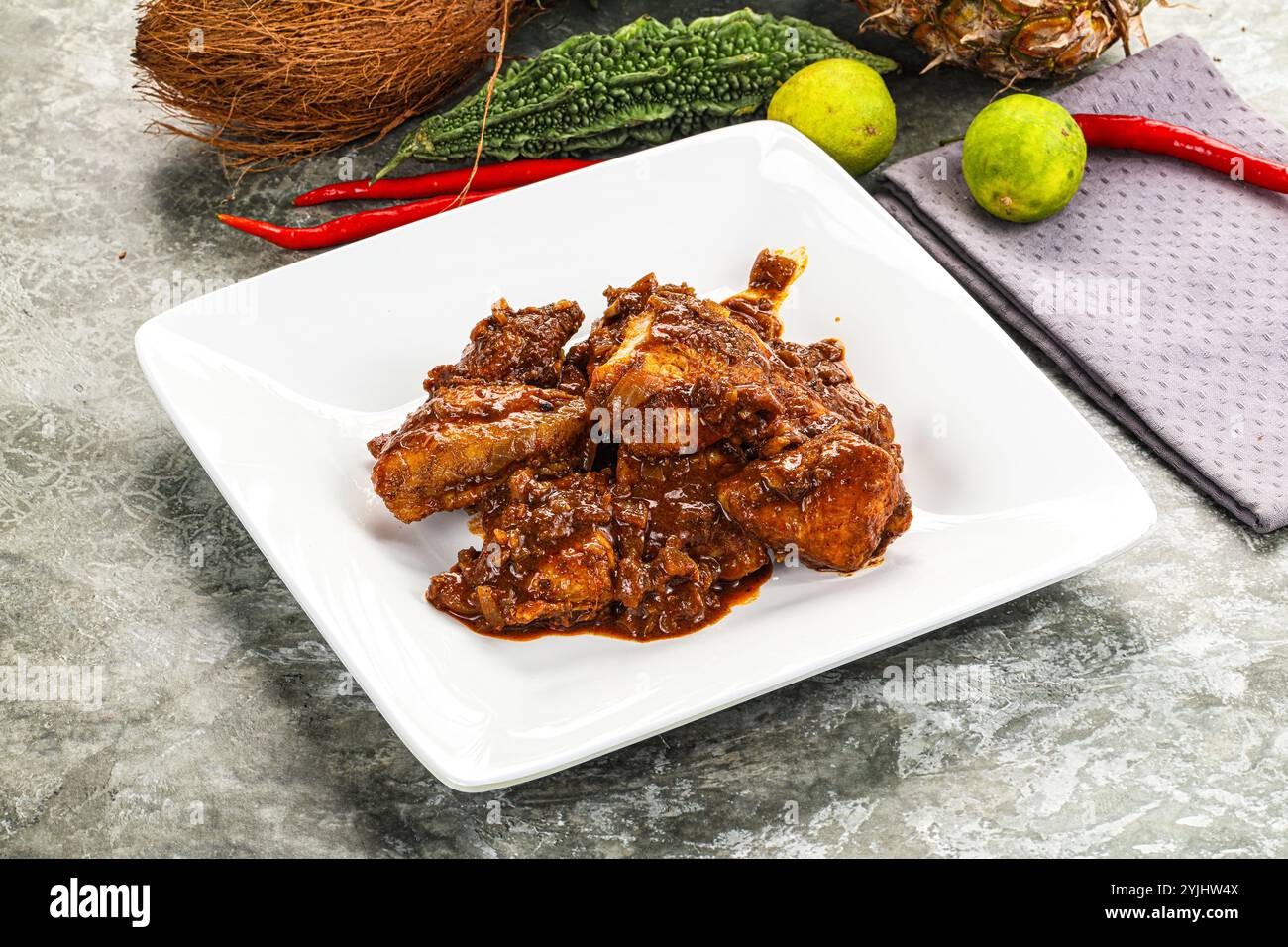 Indian cuisine - Vindaloo fish with spices and garnish Stock Photo - Alamy