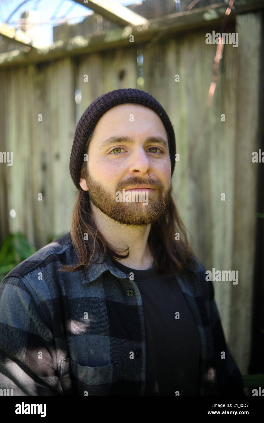 Portrait of a Young Man Wearing a Beanie and Flannel Shirt Stock Photo ...