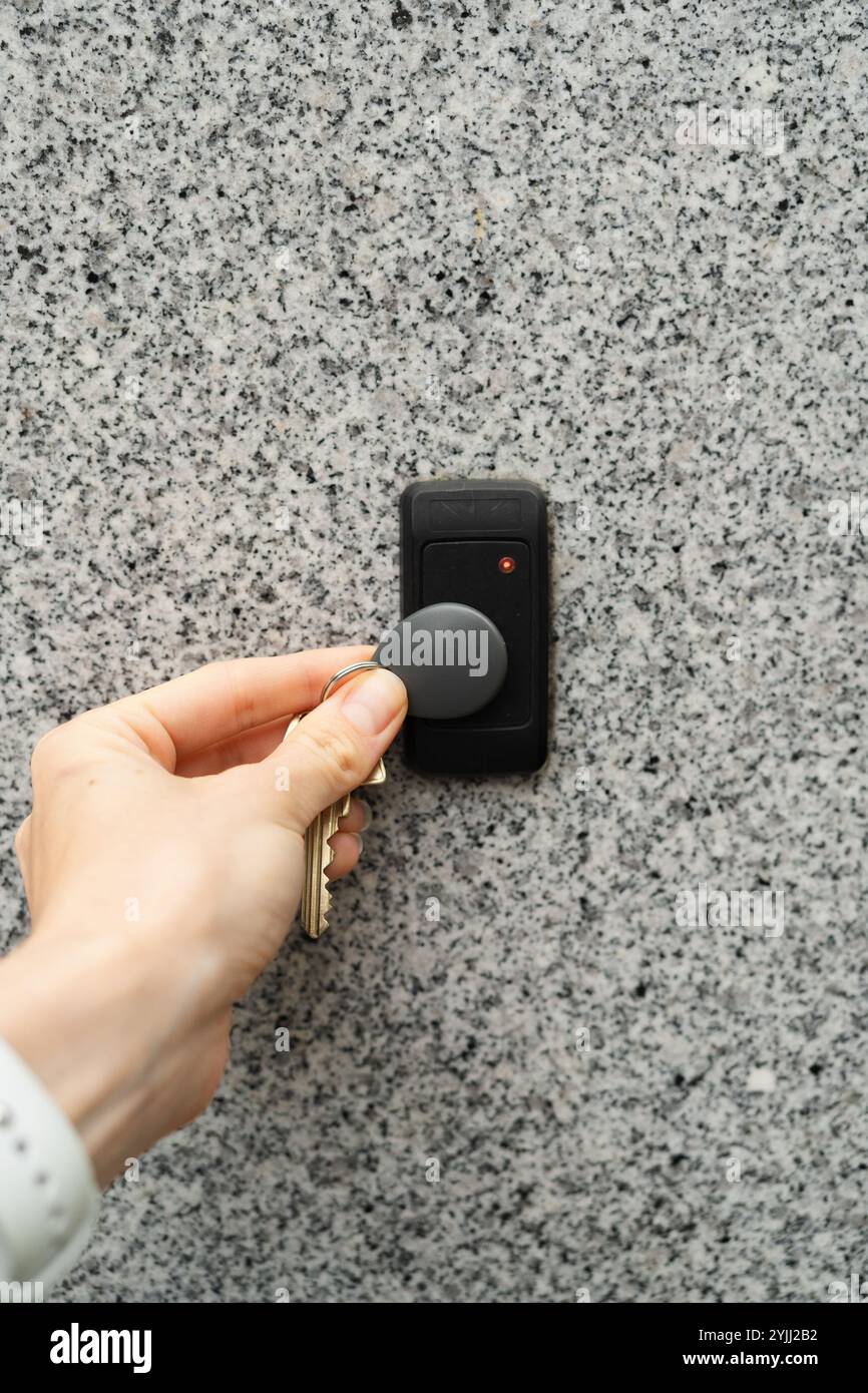 Woman's hand opening door protected with security system Stock Photo ...