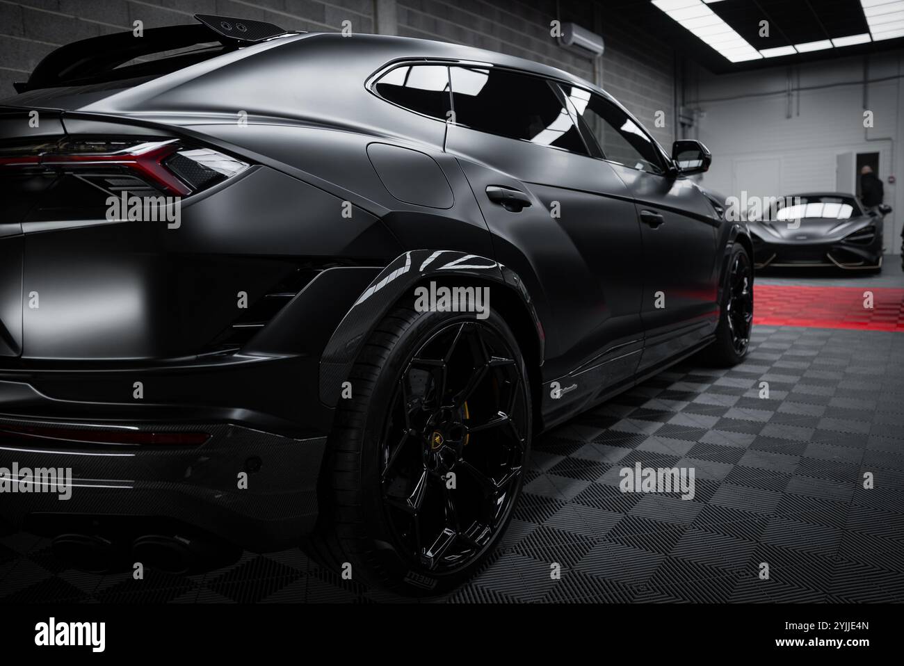 Matte Black Lamborghini Urus Performante in Modern Garage Setting Stock ...
