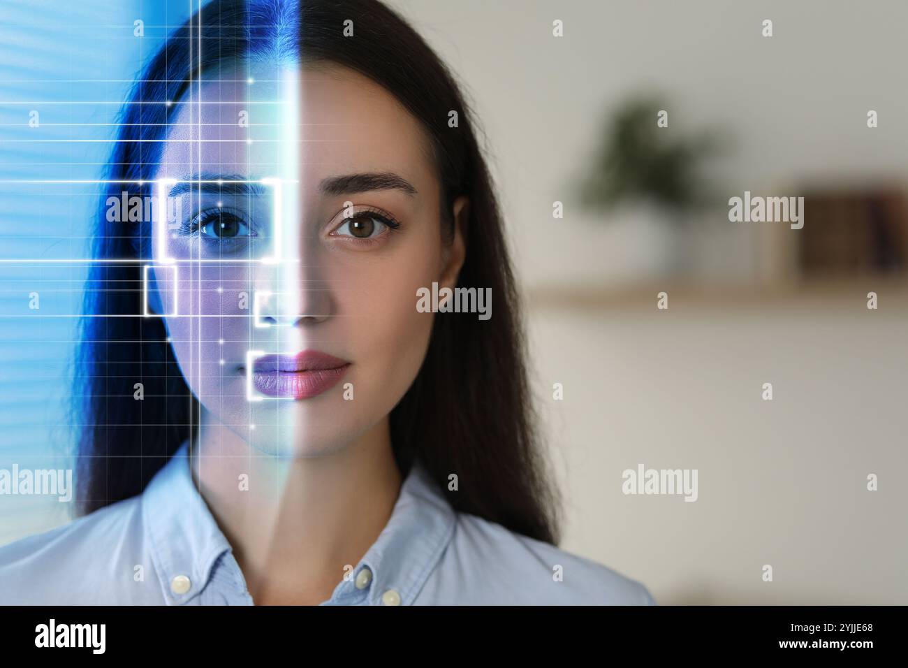 Facial recognition system. Woman undergoing biometric verification at ...