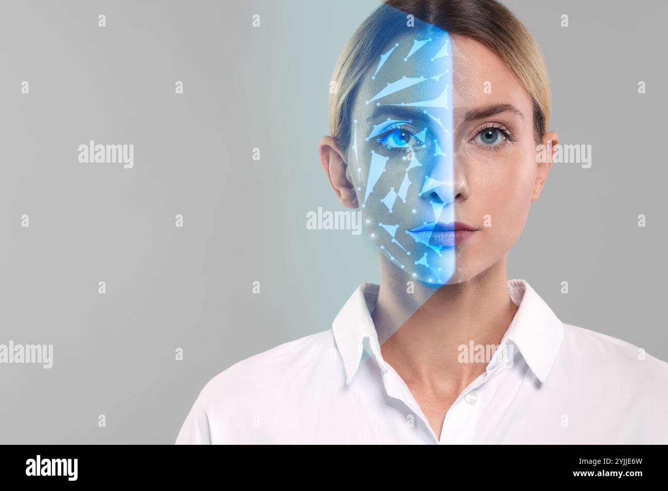 Facial recognition system. Woman undergoing biometric verification on ...