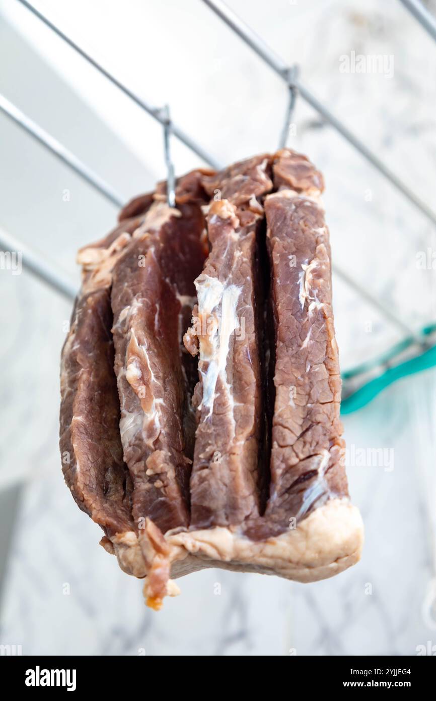 Traditional salted and aged sun-dried meat Stock Photo - Alamy