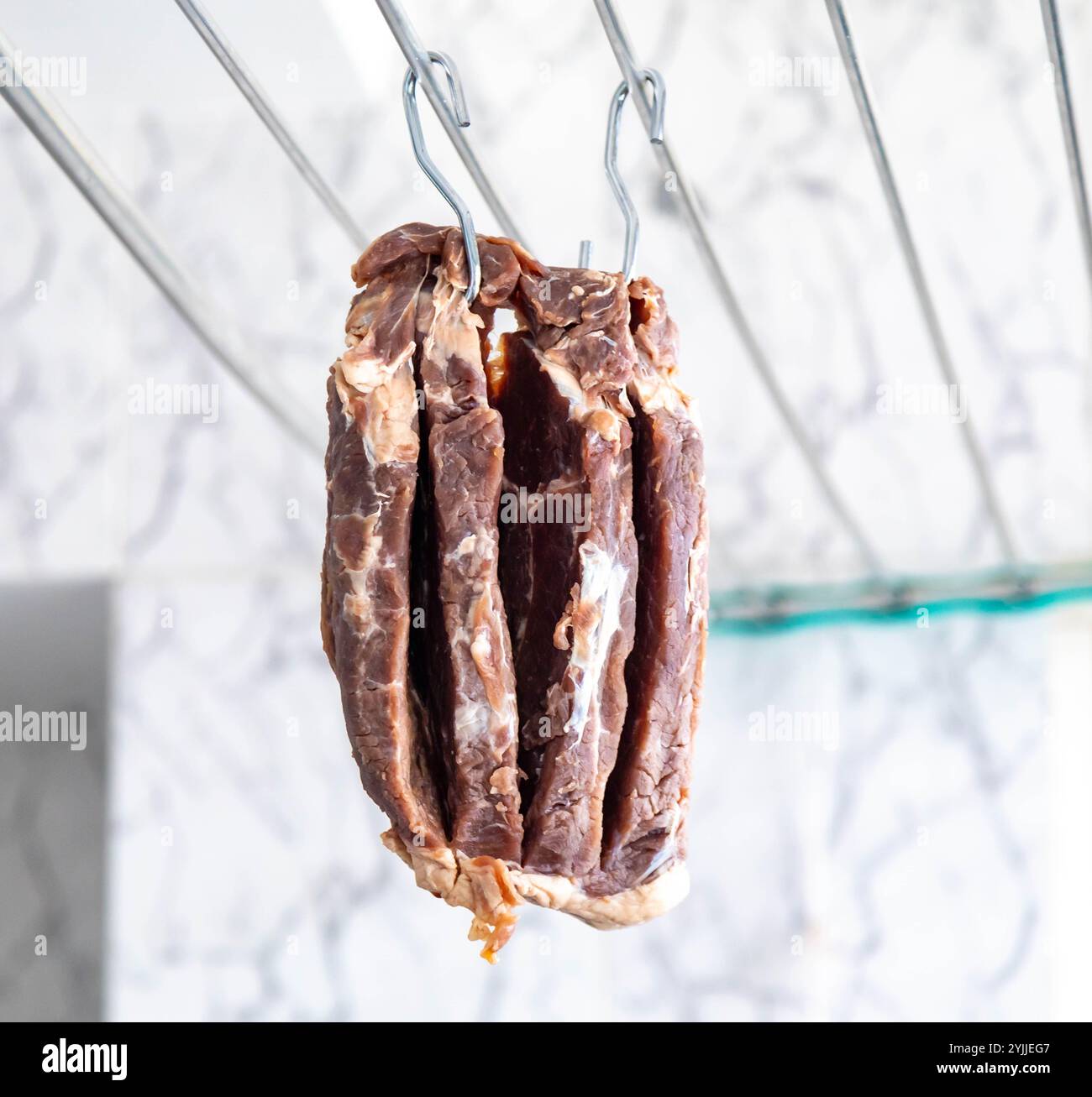 Traditional salted and aged sun-dried meat Stock Photo - Alamy