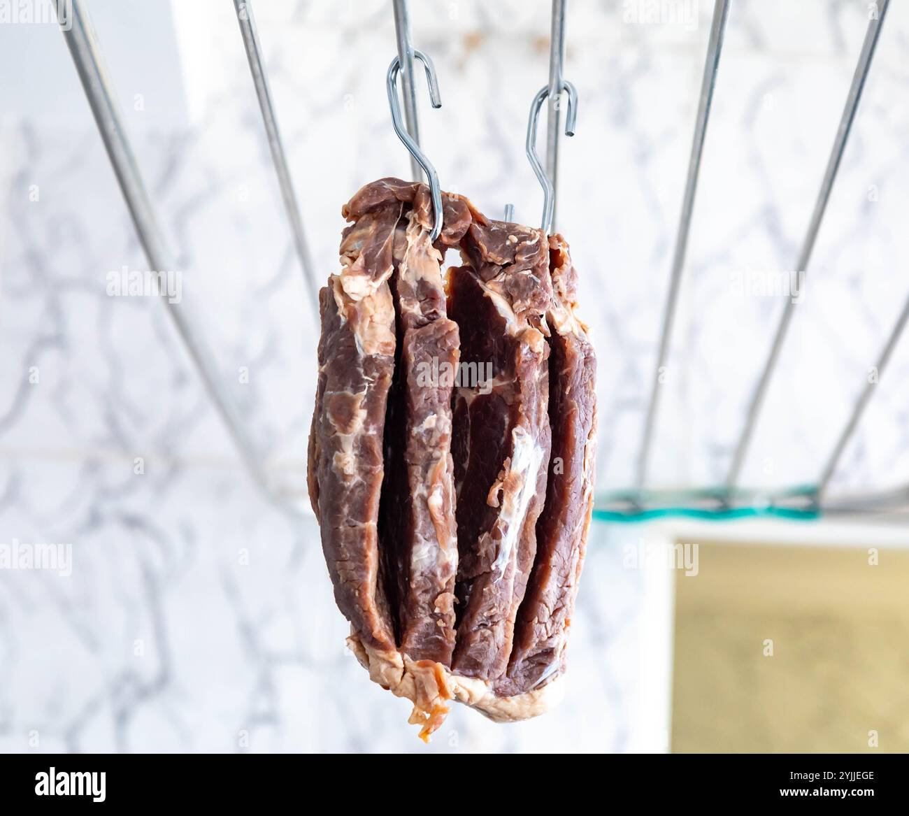 Traditional salted and aged sun-dried meat Stock Photo - Alamy