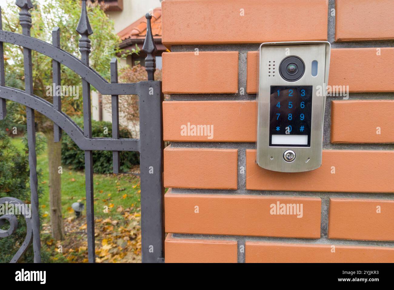 Gate intercom keypad on brick pillar Stock Photo - Alamy