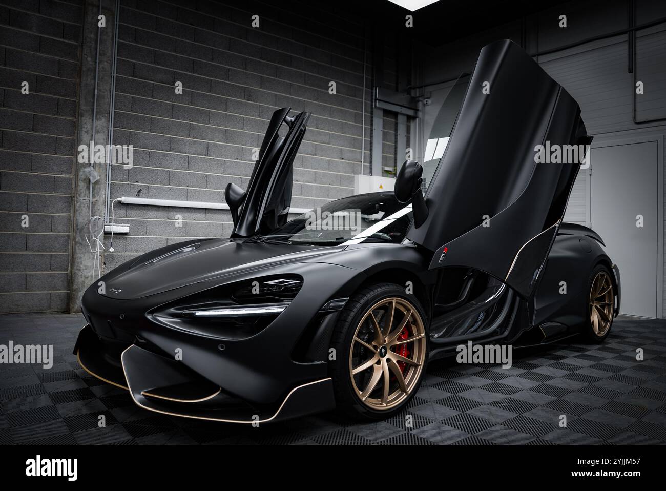 McLaren 720S with Dihedral Doors Open in Industrial Garage Stock Photo ...