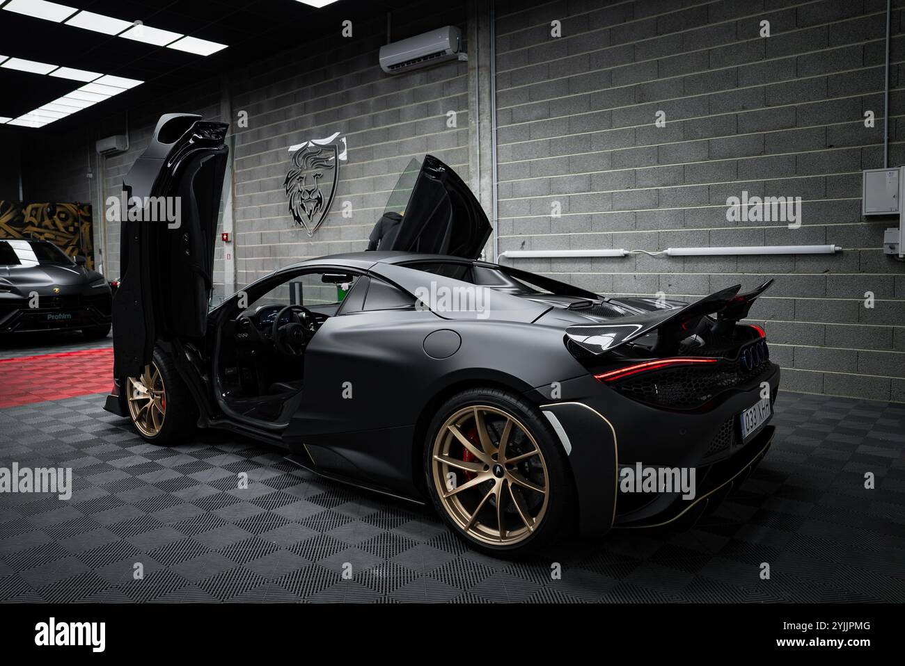McLaren 720S with Dihedral Doors Open in Luxury Showroom Stock Photo ...