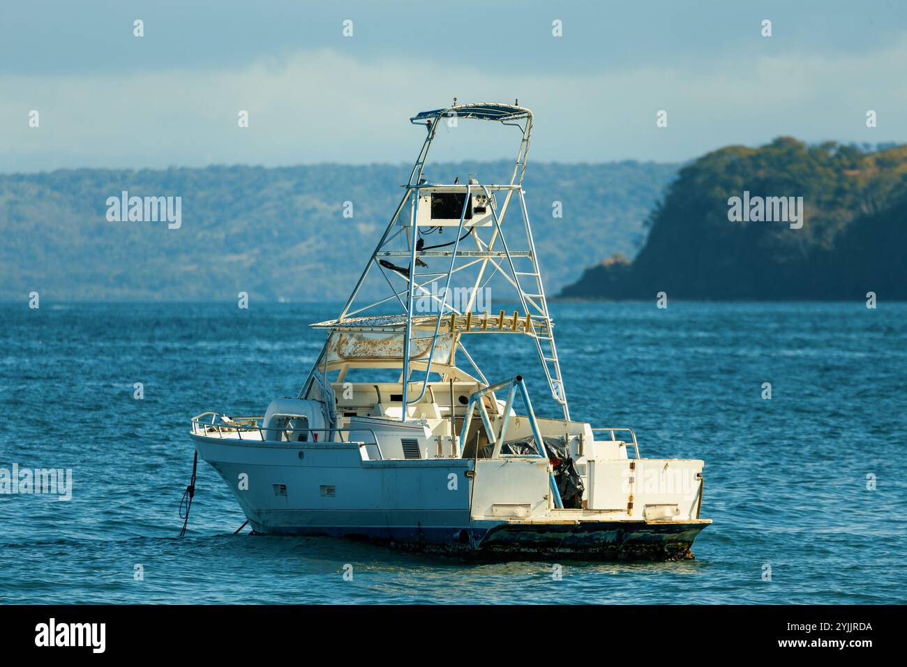 Motor boat anchored on Ocotal beach, view of Pacific ocean, El Coco ...