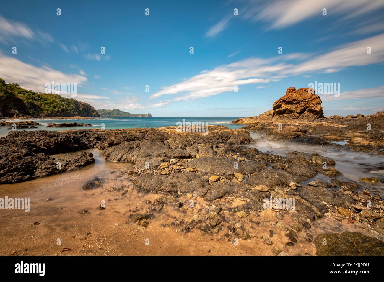 Long exposure, pacific ocean waves on rock in Playa Ocotal, El Coco ...