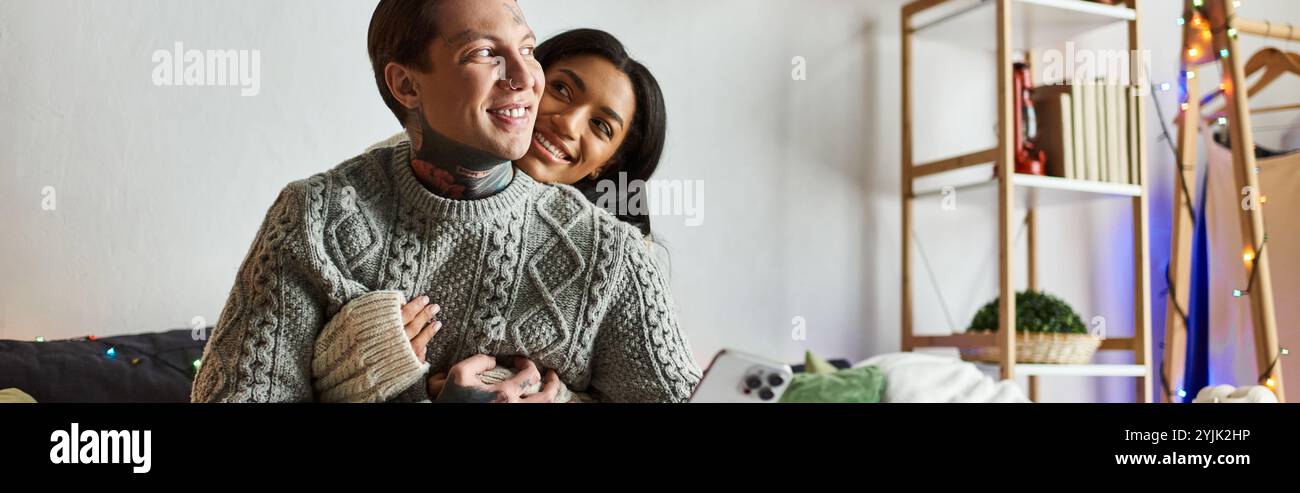 A couple shares a tender moment at home during Christmas, radiating ...