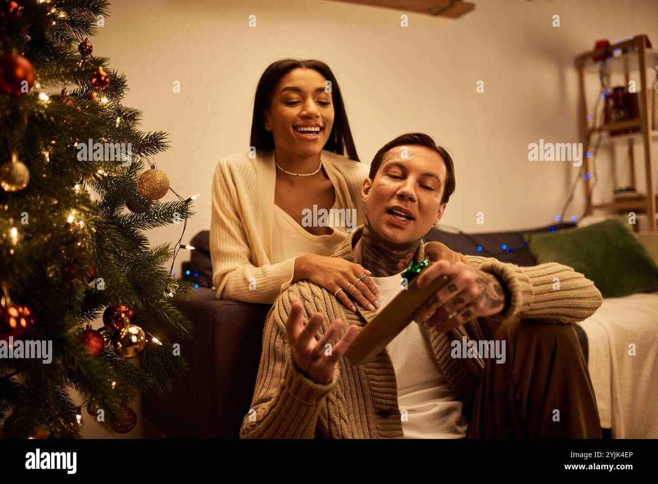 Two people embrace the spirit of Christmas, exchanging warmth and ...