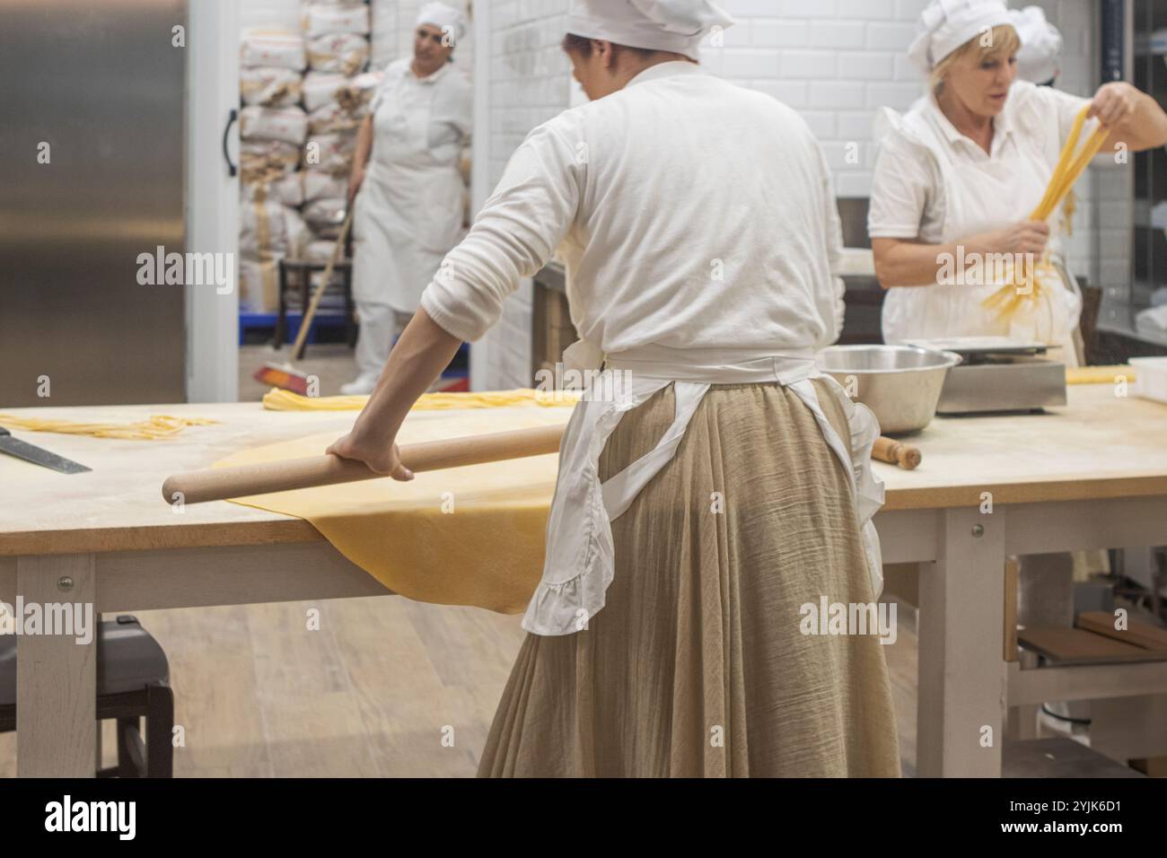 Traditional italian cook cutting pasta. Delicious homemade cuisine ...