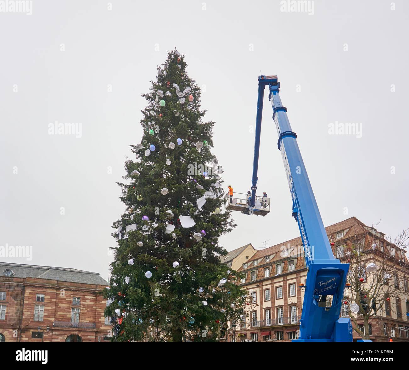 Strasbourg, France - Nov 09, 2024: Rising platform and crane decorating ...