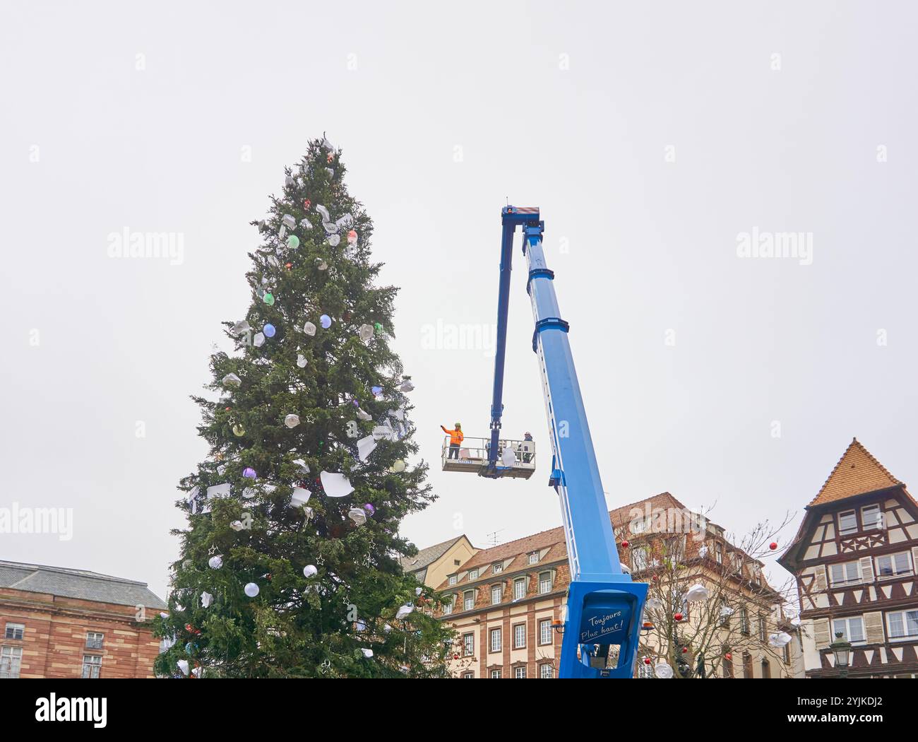 Strasbourg, France - Nov 09, 2024: Rising platform and crane decorating ...