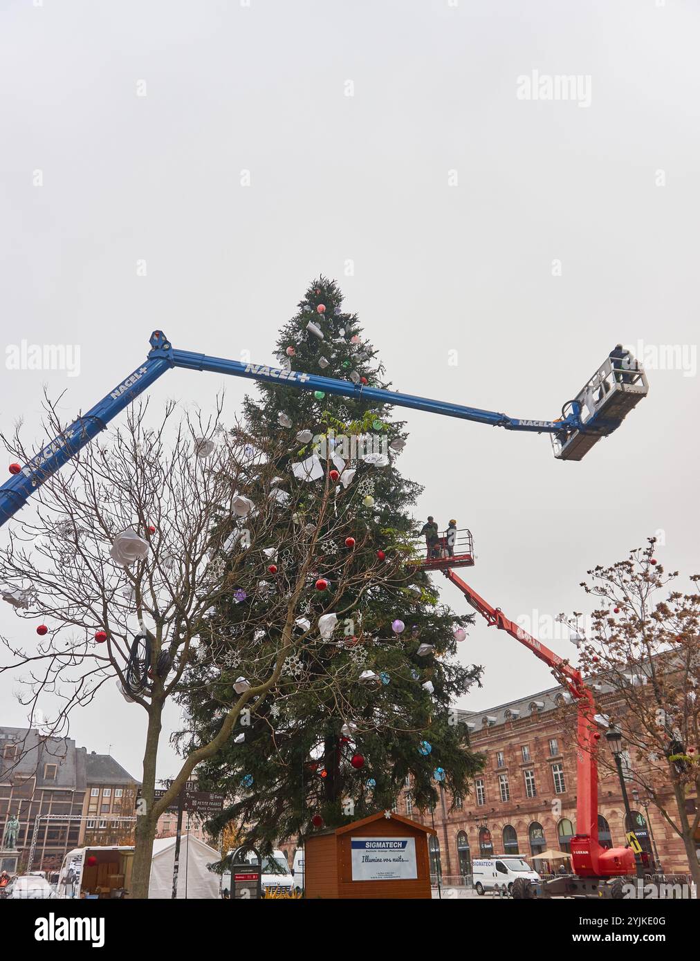 Strasbourg, France - Nov 09, 2024: Rising platform and crane decorating ...