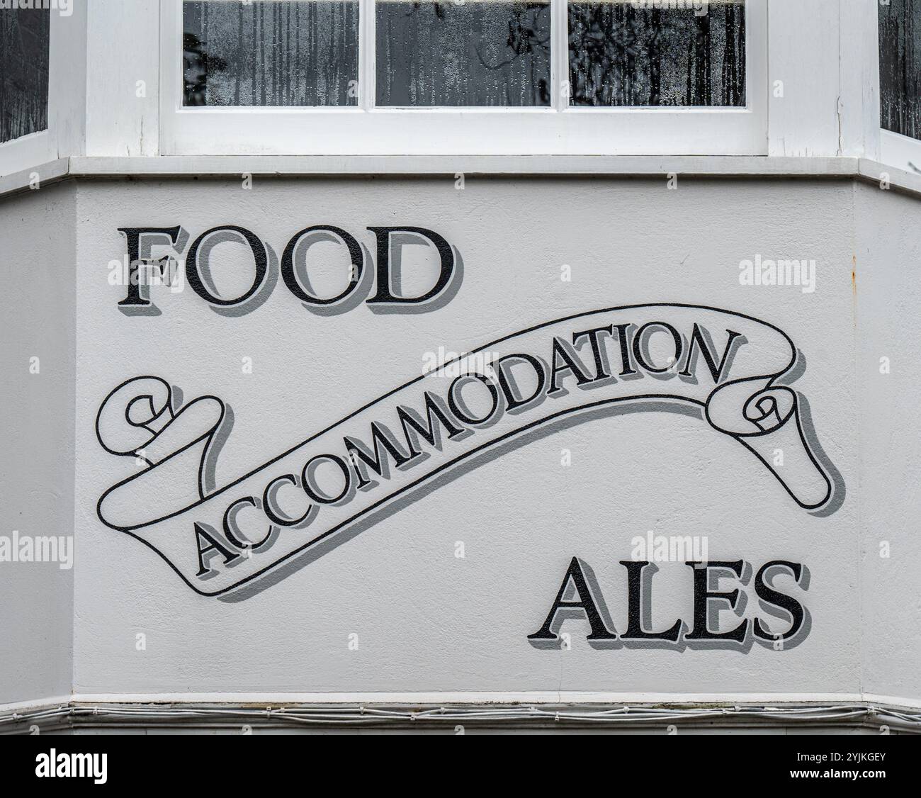 Food, drink and accommodation sign painted on the side of a public ...