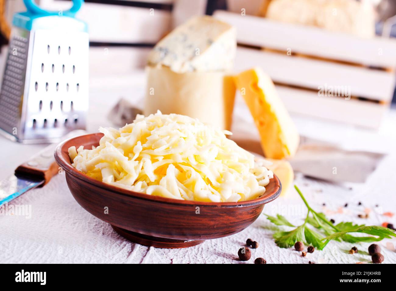 Shredded mozzarella and red cheddar cheese in bowl, mix cheeses Stock ...