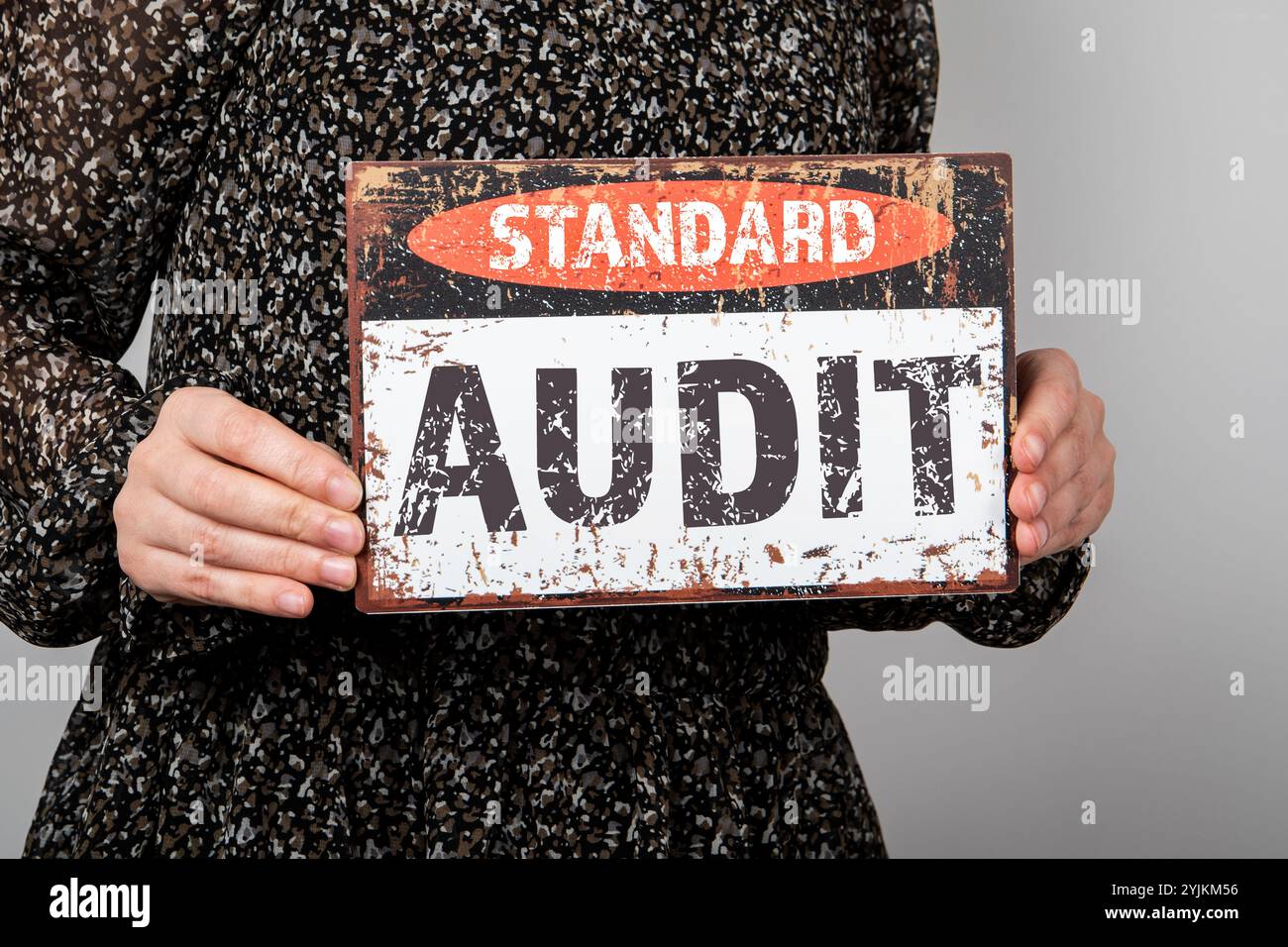STANDARD and Audit sign. Warning sign with text in woman hands Stock ...