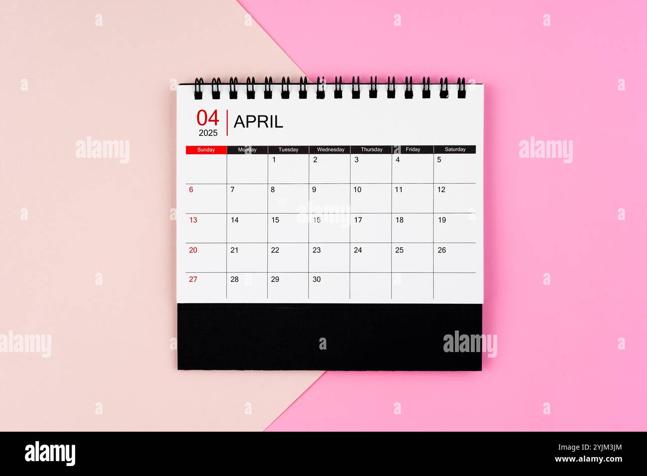 April 2025 desk calendar on pink color background. Page of annual ...