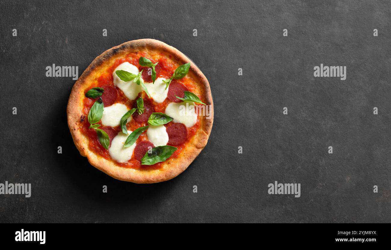Pizza with mozzarella, pepperoni, tomato sauce and basil. Homemade ...