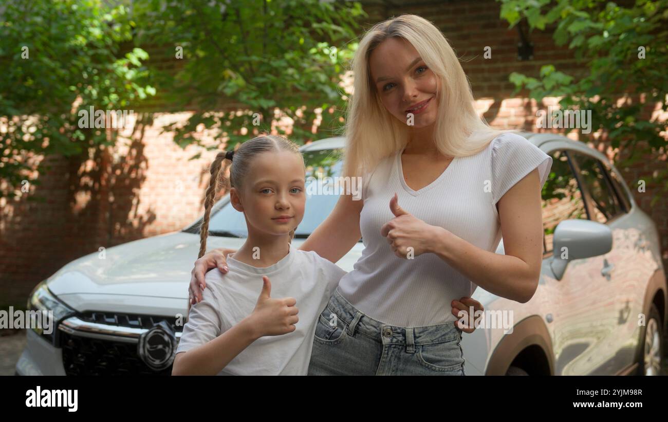Cute happy Caucasian family woman female mother mom driver client hug ...