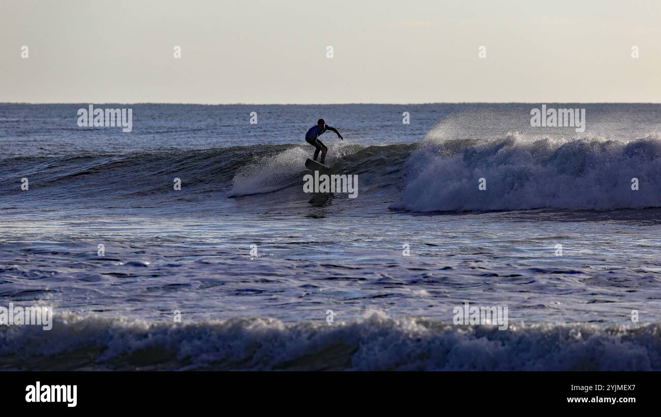 Viana do Castelo, Portugal - January 12, 2024: Surfers riding Atlantic ...