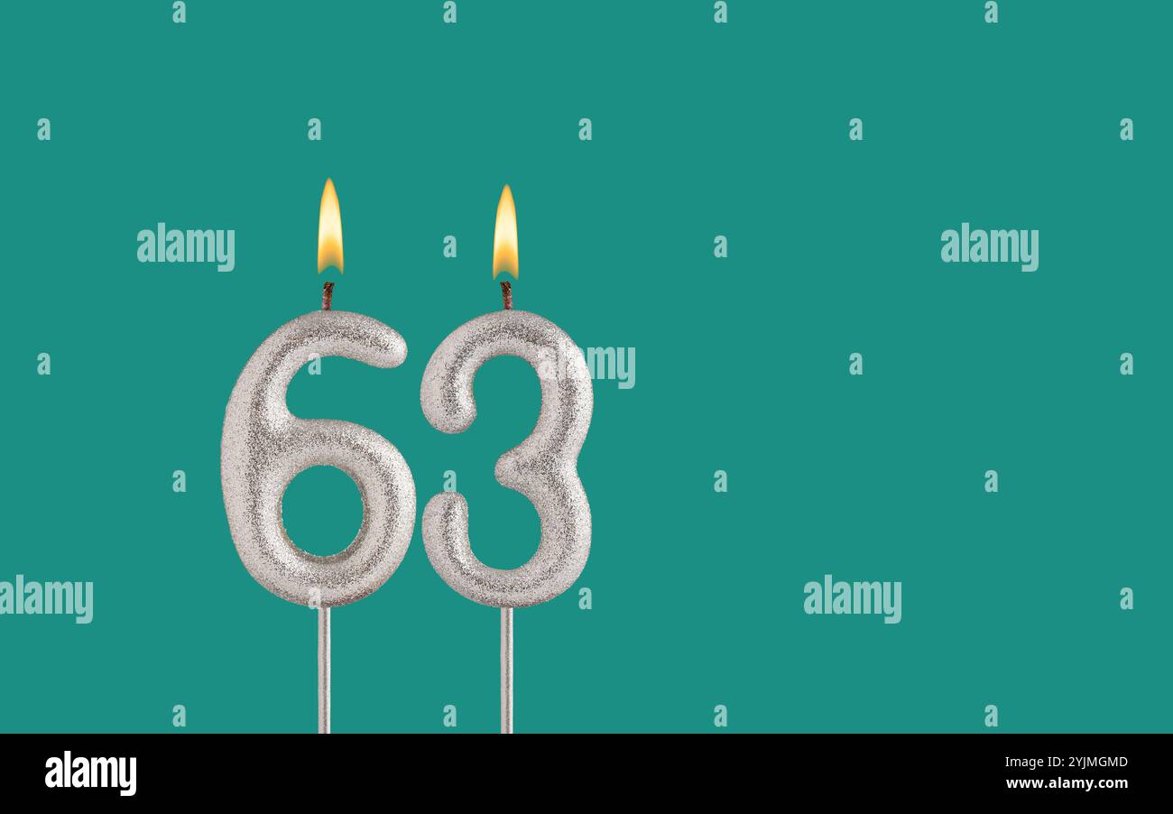 Birthday candle number 63 - Card on a green background Stock Photo - Alamy