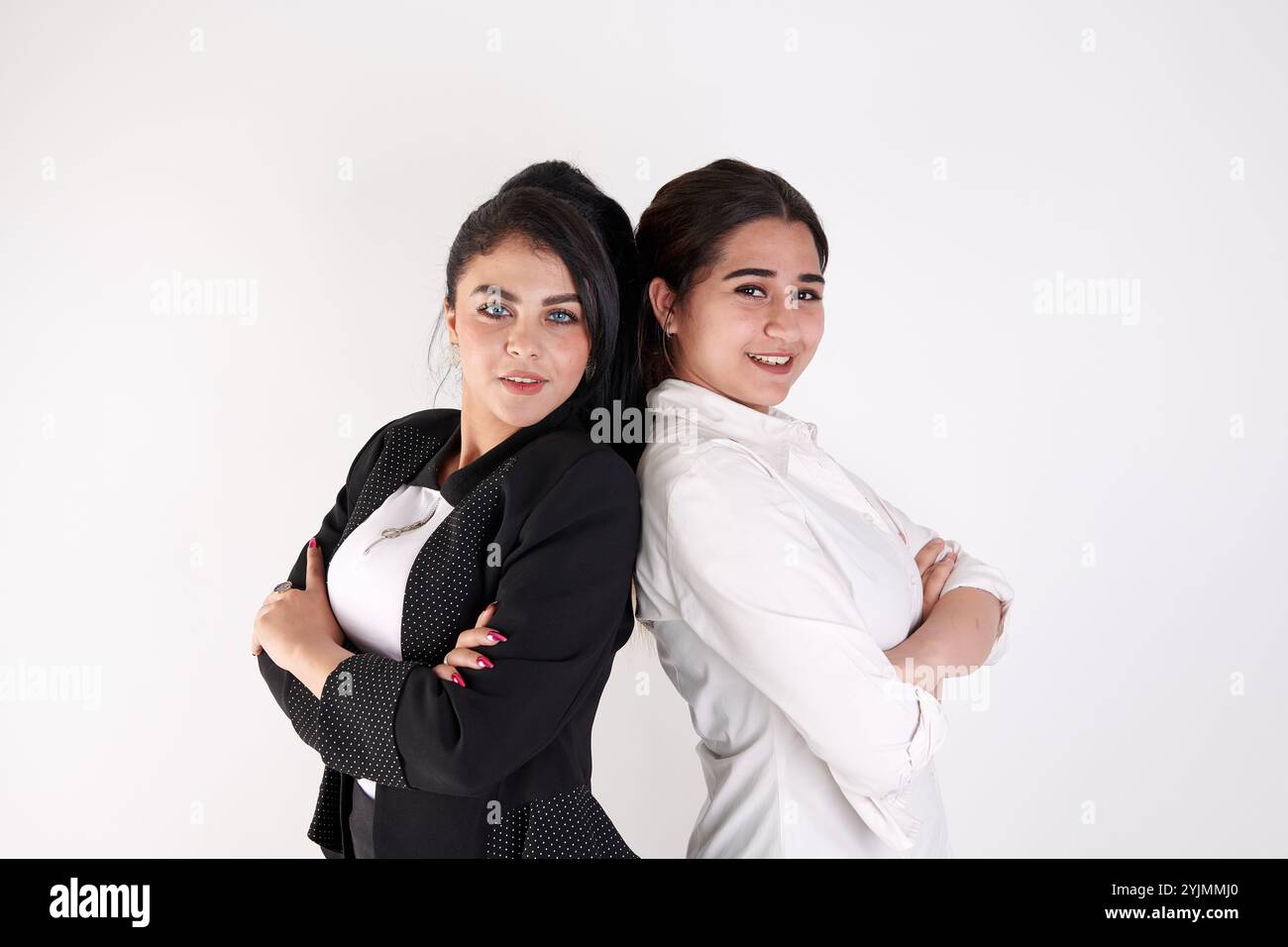 two smiling business women on white background Stock Photo - Alamy