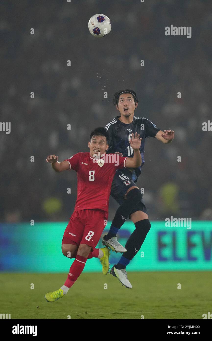 Japan's Koki Machida, right, battles for the ball against Indonesia's ...