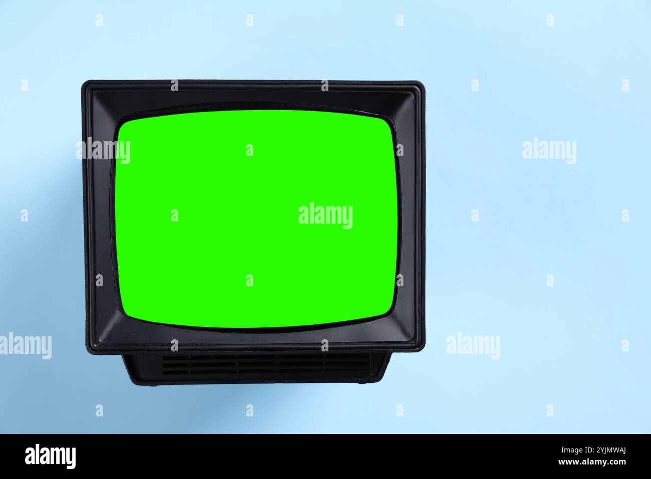 Retro Tv set with green screen on light blue background, space for ...