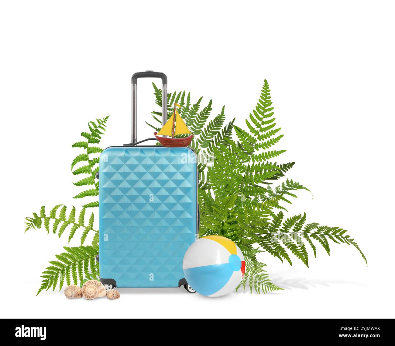 Light blue travel suitcase, tropical leaves, beach ball, toy sailboat ...