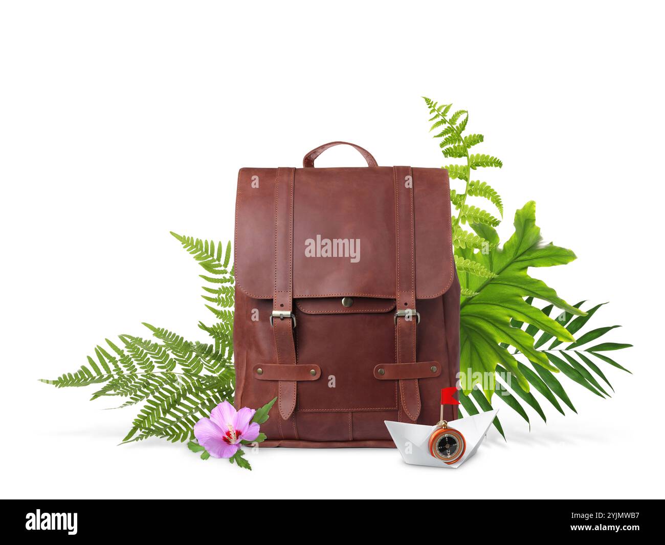 Leather backpack, paper boat with compass, tropical leaves and flower ...