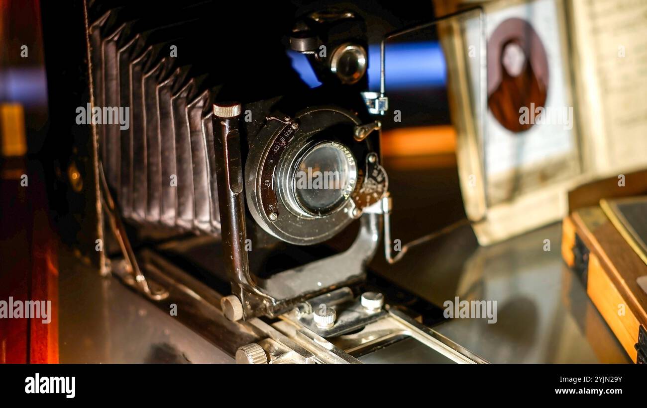 An old vintage camera on a table with blurred background. Antique ...