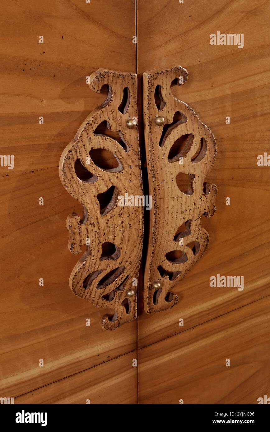 Detail of the solid wood handle of a classic wardrobe Stock Photo - Alamy