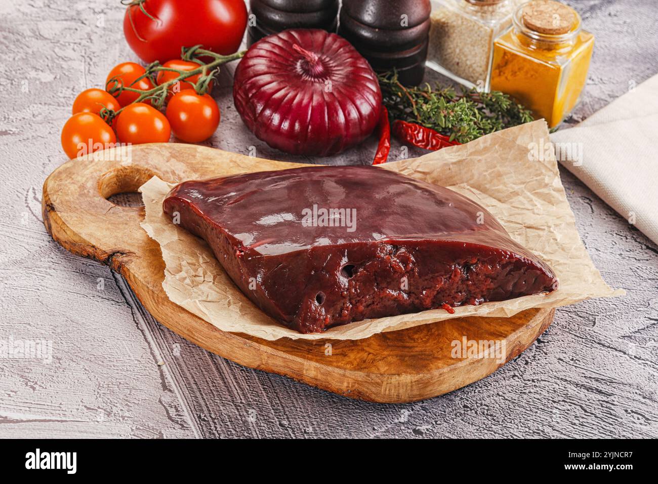 Raw beef liver piece for cooking Stock Photo - Alamy