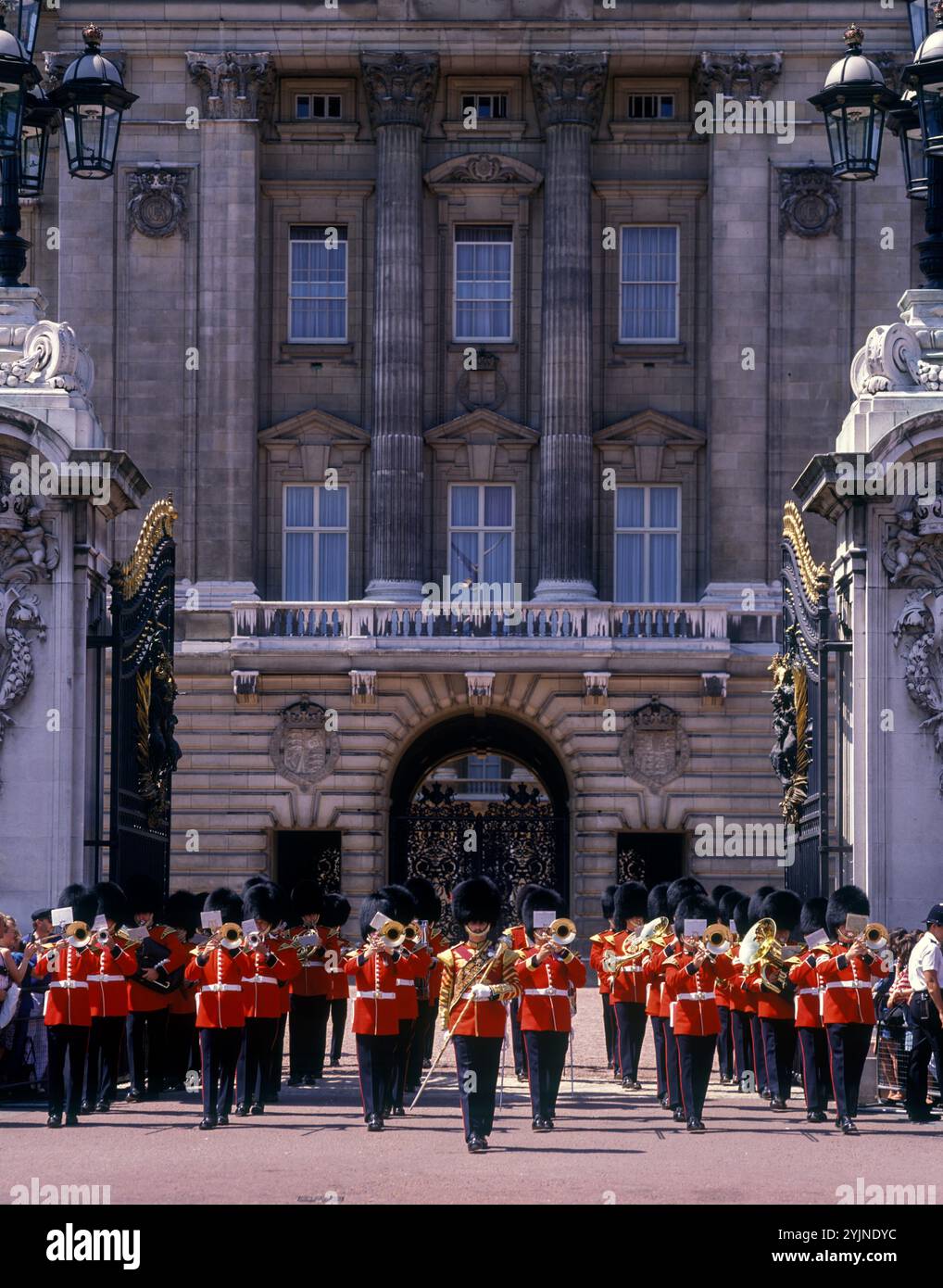 MILITARY MARCHING BRASS BAND PARADE CHANGING THE GUARD PASSING ENTRANCE GATE BUCKINGHAM PALACE ...