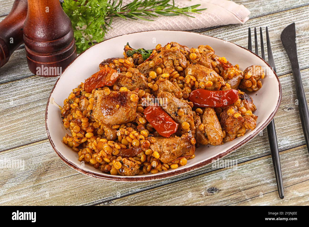 Rasted chicken meat with ptitim and vegetables Stock Photo - Alamy