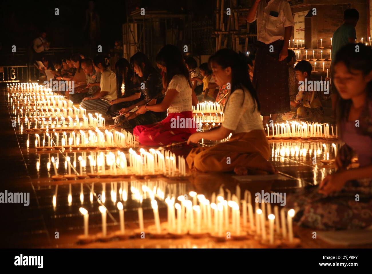 Yangon, Myanmar. 15th Nov, 2024. People light candles to celebrate ...