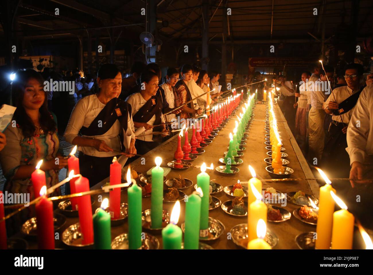 Yangon, Myanmar. 15th Nov, 2024. People light candles to celebrate ...