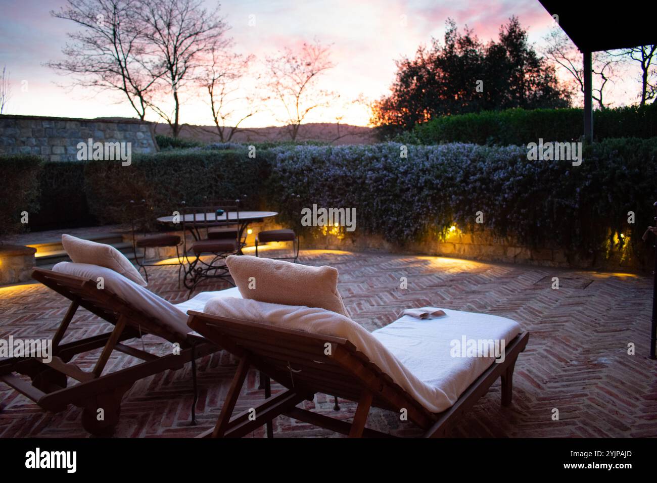 Sunset on romantic patio in Tuscany Italy Stock Photo - Alamy