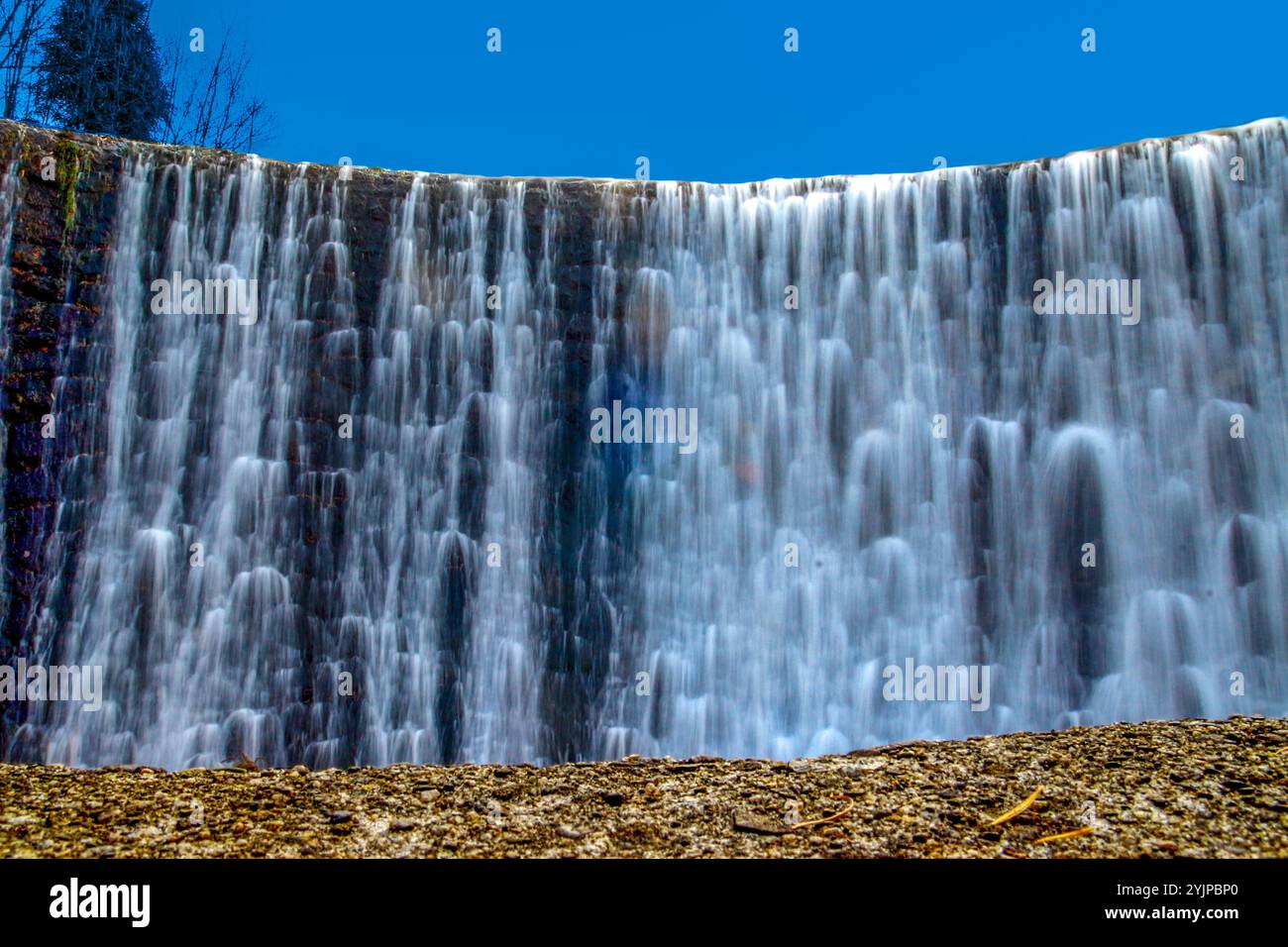 High water level on the Vistula River, water falling from the waterfall ...